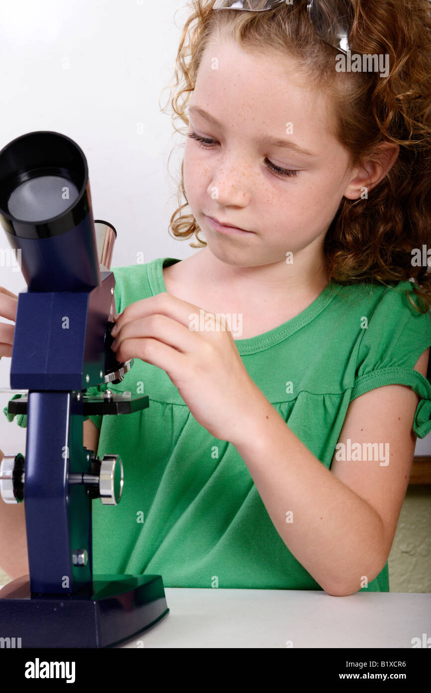 Stock Photograph of a student using a microscope Stock Photo - Alamy
