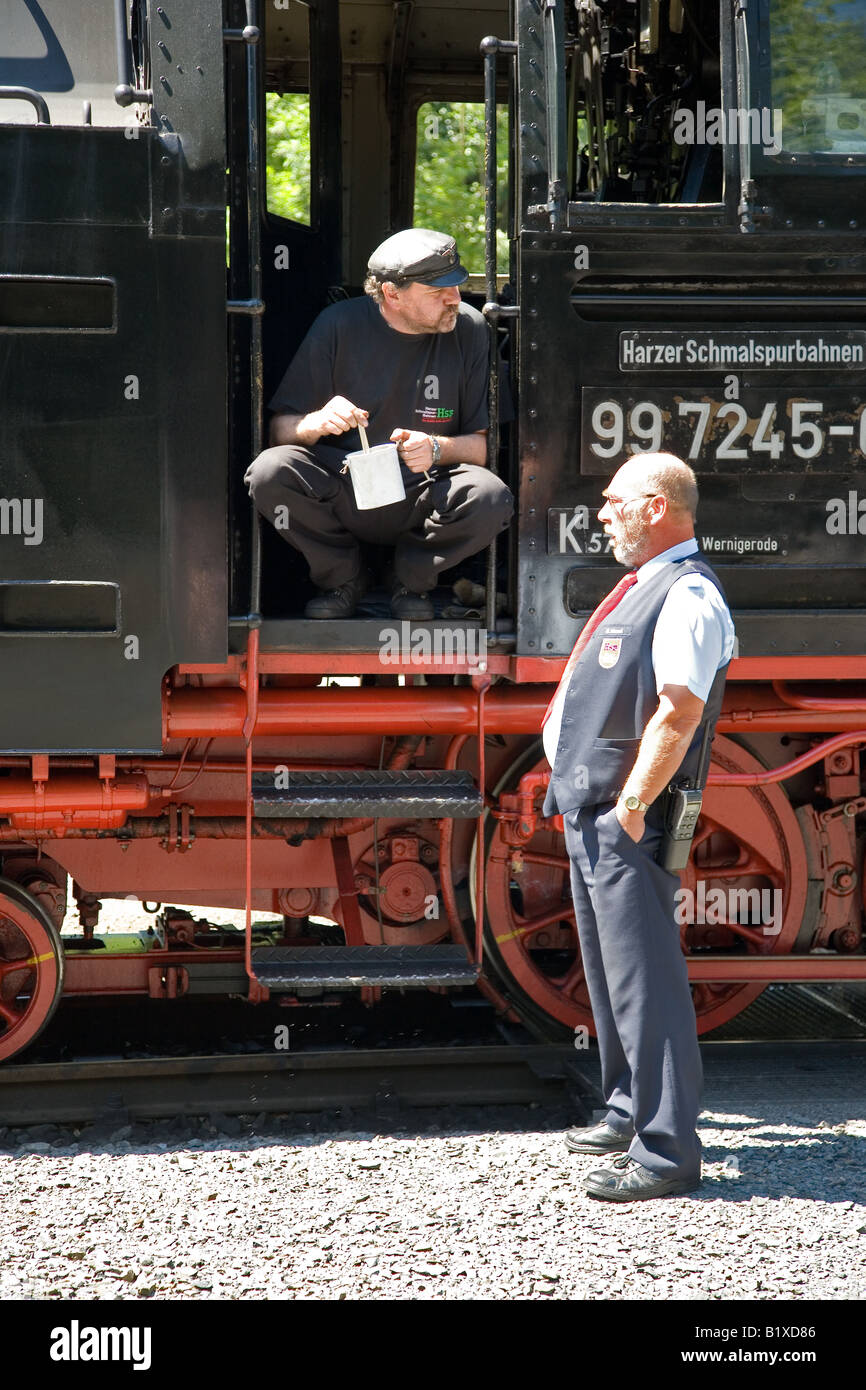 Engine driver and guard on the narrow gauge steam railway between ...