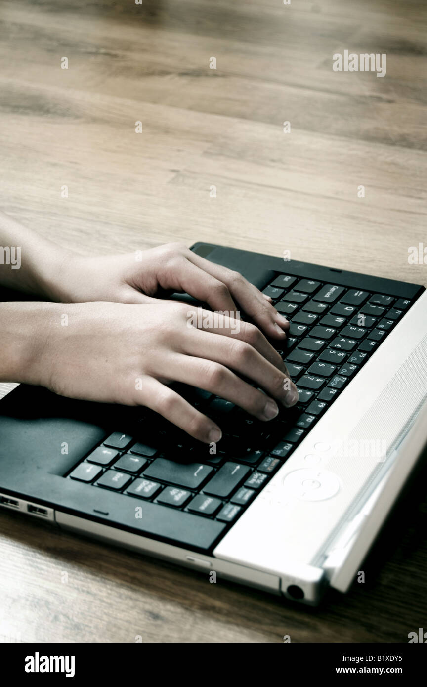 Working on laptop Stock Photo - Alamy