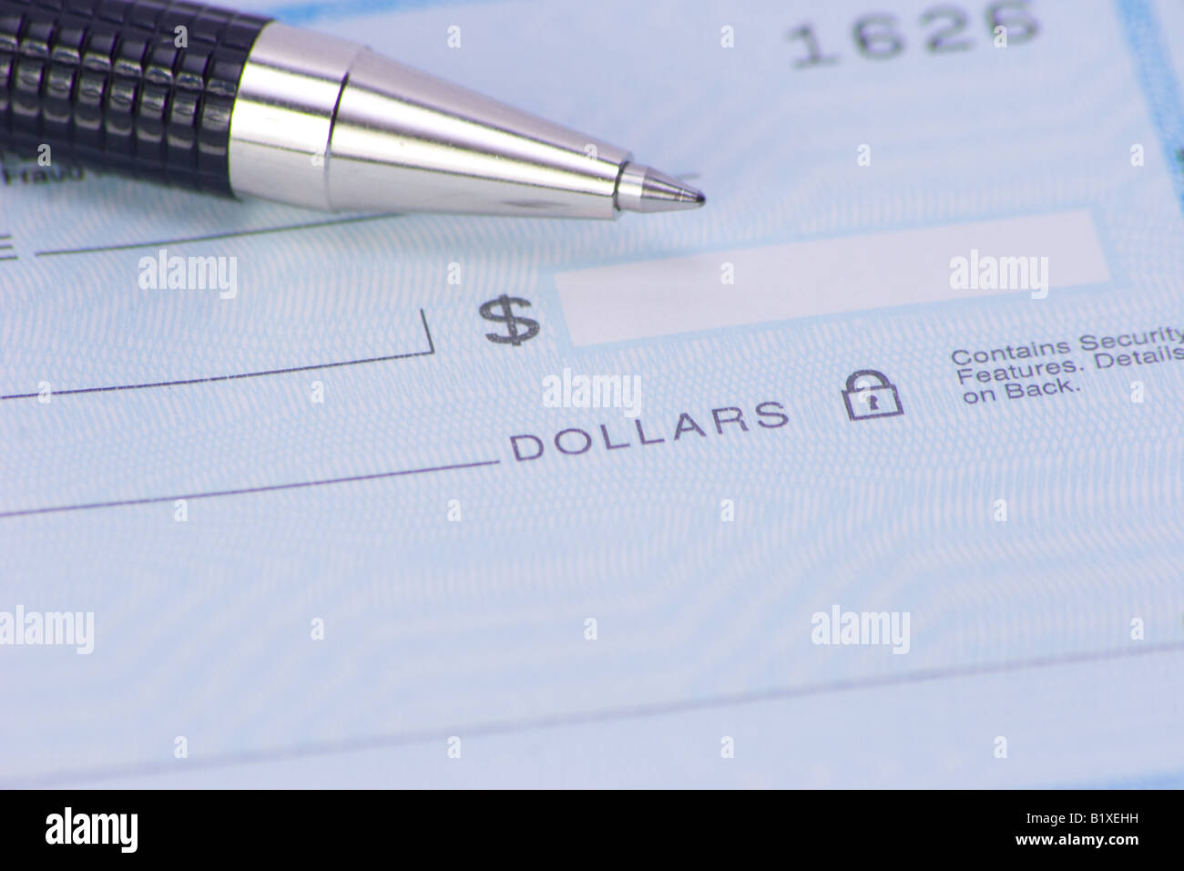 Check and pen Stock Photo - Alamy