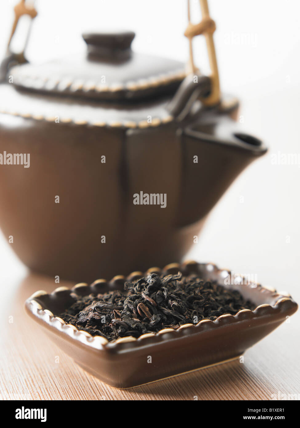 chinese tea leaves with tea pot as background Stock Photo - Alamy