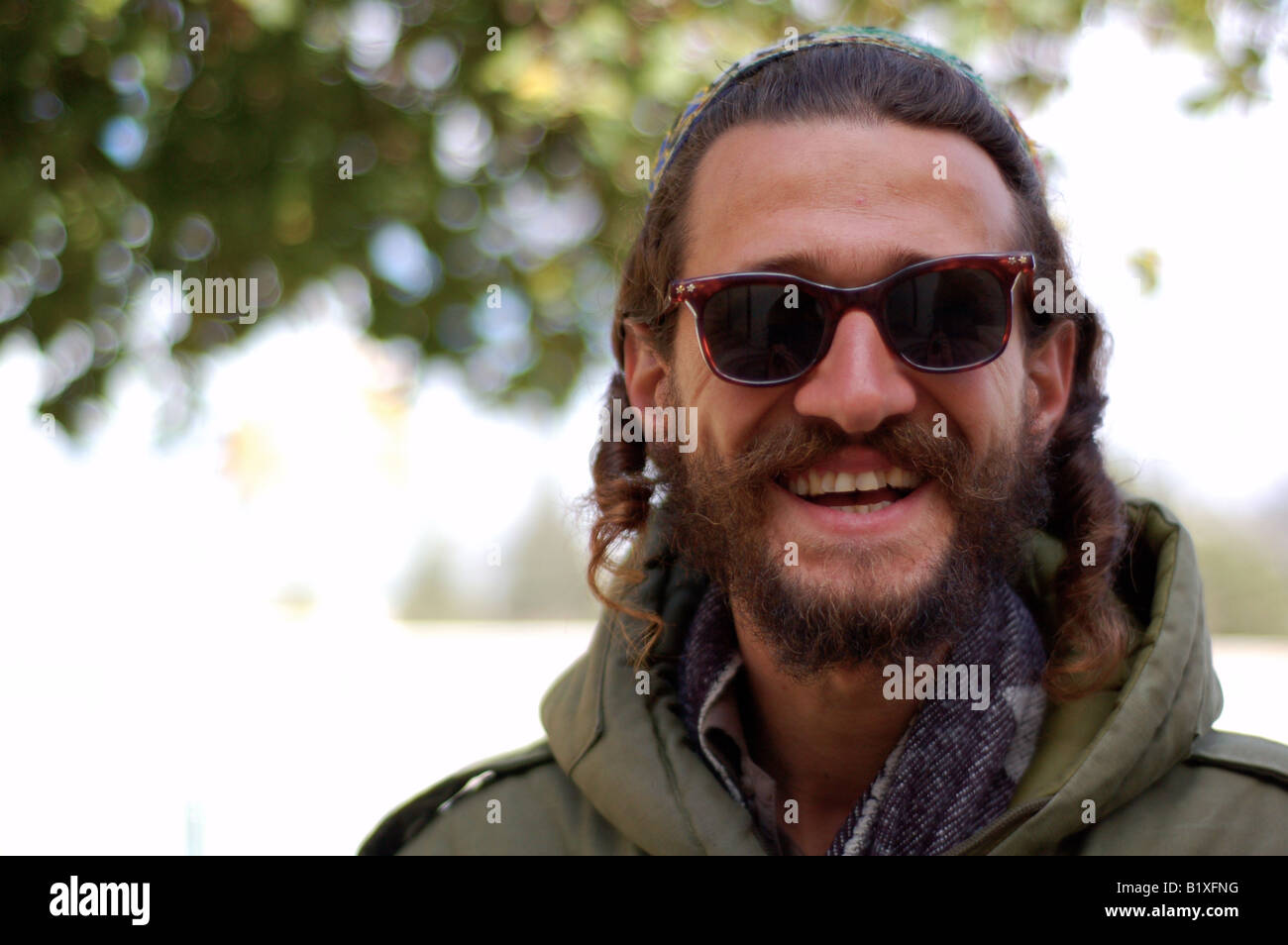 A funky, young Orthodox Jewish man smiles at the camera in Jerusalem's ...