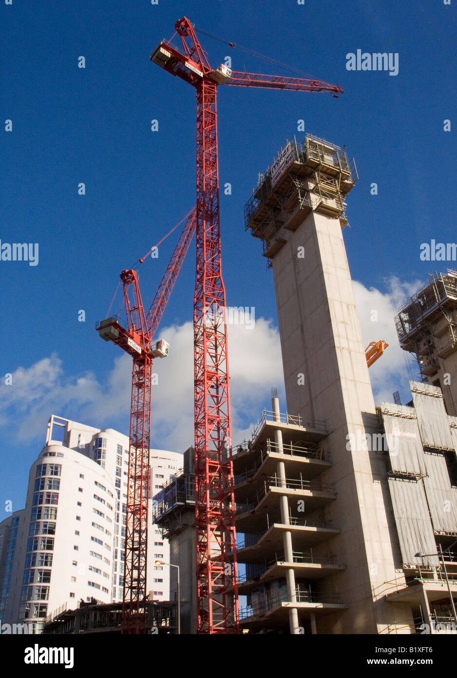 buildings under construction with red tower crane blue sky Stock Photo ...