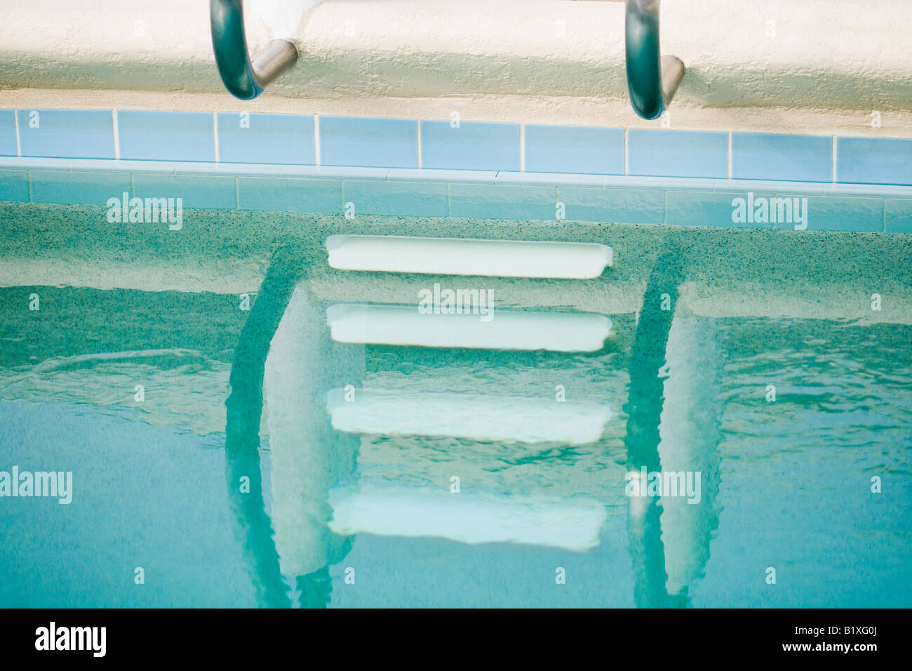 Reflection of steps in a swimming pool Stock Photo - Alamy