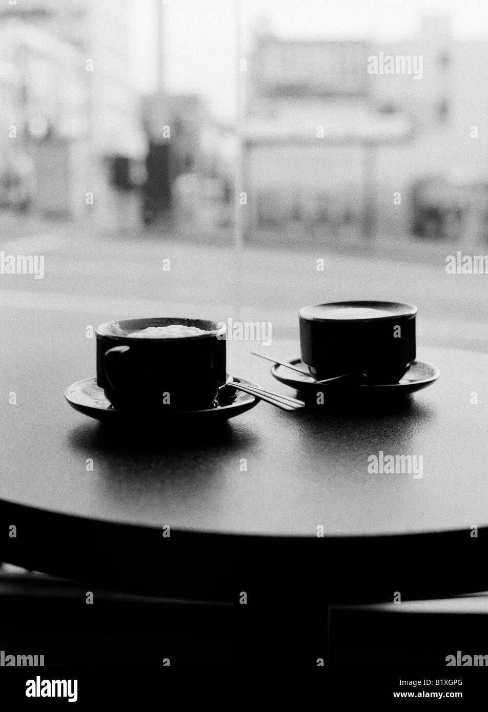 Coffee sitting on table Black and White Stock Photos & Images - Alamy