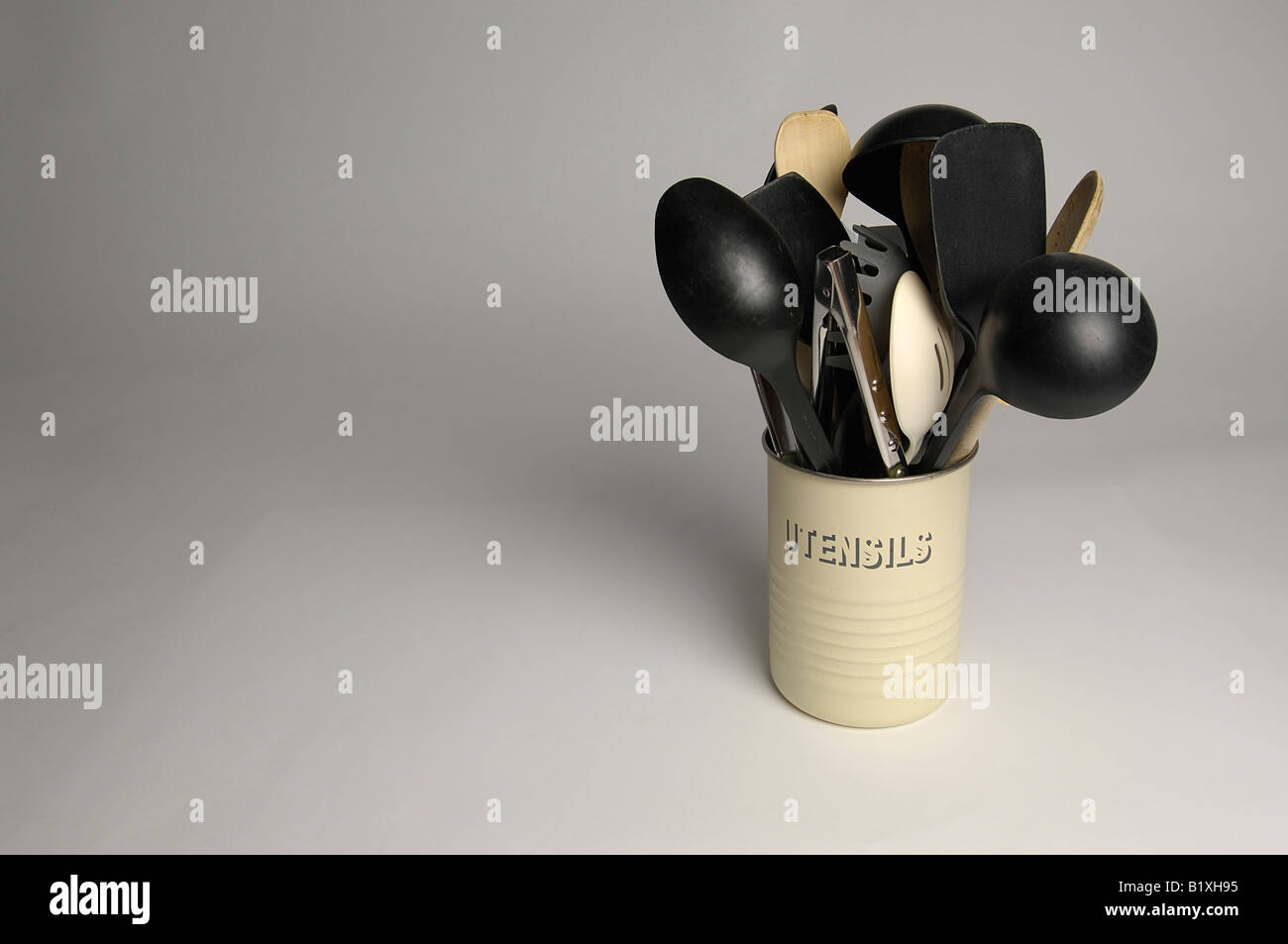 Kitchen utensils stacked in a display can Stock Photo - Alamy