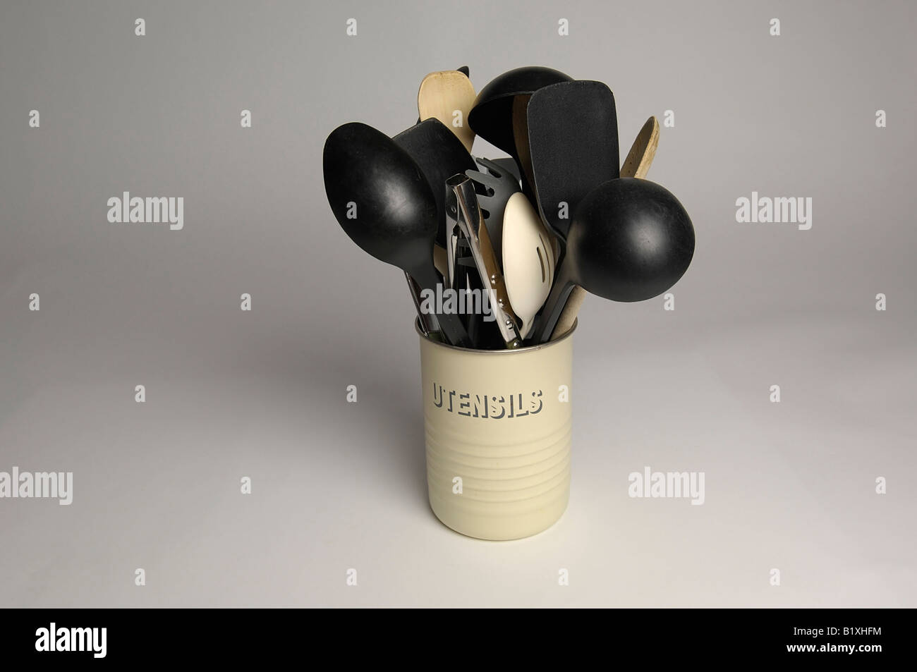 Kitchen utensils stacked in a display can Stock Photo - Alamy
