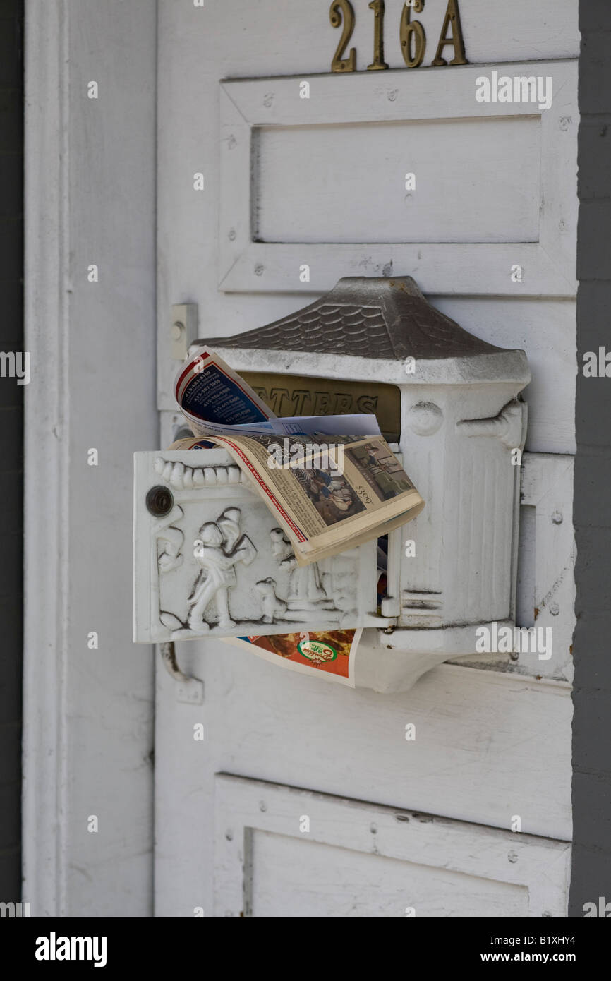 Mailbox overflowing with junk mail Stock Photo - Alamy