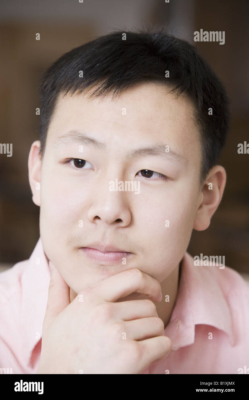 Close-up of a teenage boy thinking Stock Photo - Alamy