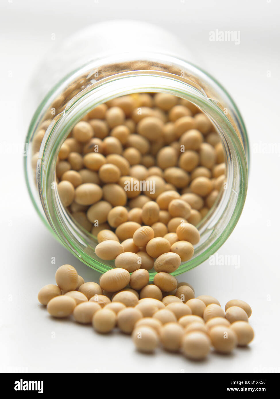 front view of soya beans pouring from jar Stock Photo - Alamy