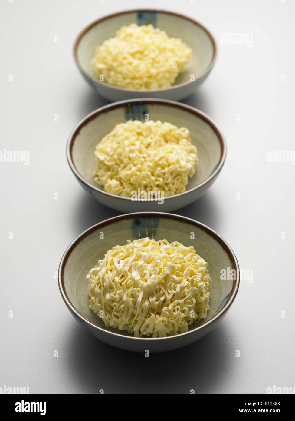 three bowls of chinese noodle Stock Photo - Alamy
