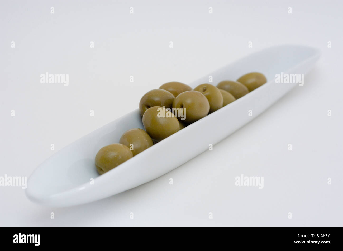 Green olilevs in a Olive boat Stock Photo - Alamy