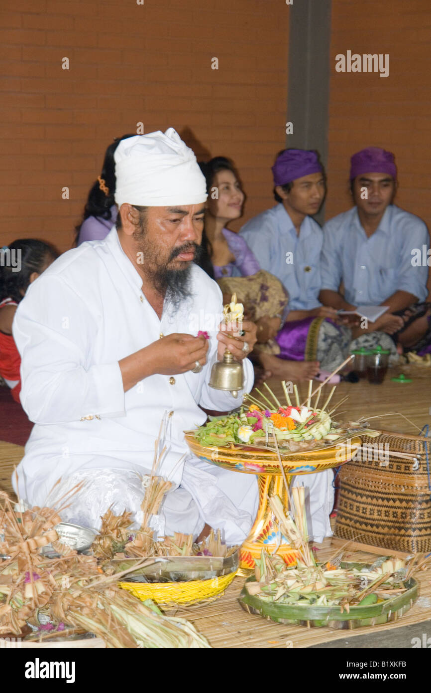 A Balinese priest officiating at a wedding ceremony (Bali - Indonesia ...