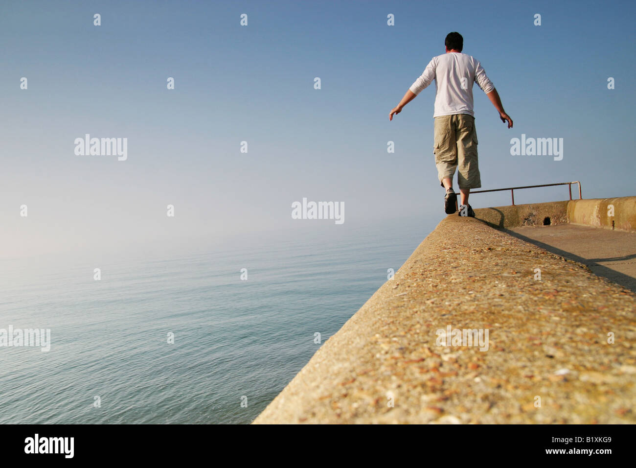 Balancing on a wall hi-res stock photography and images - Alamy