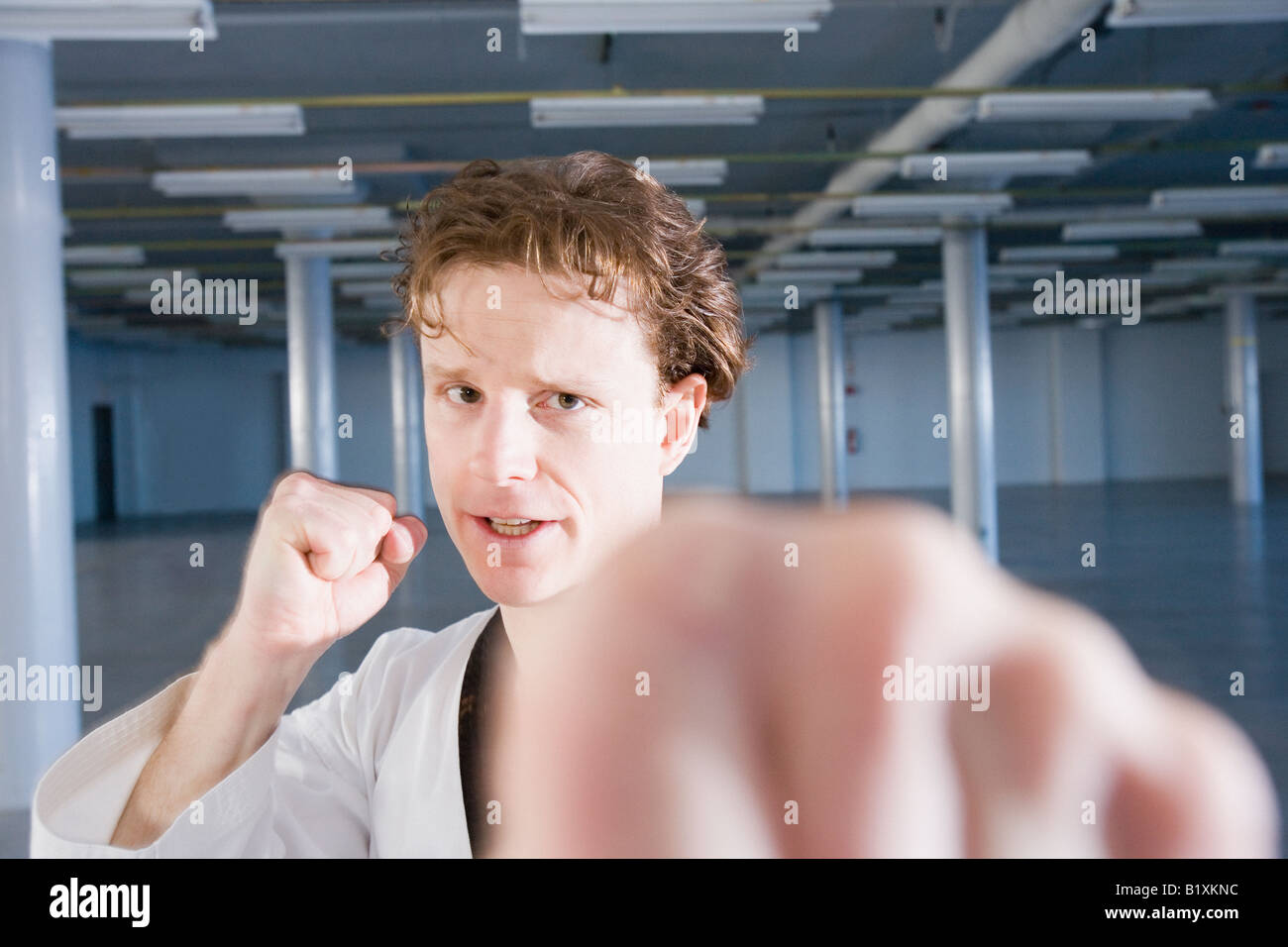 Young man practicing karate Stock Photo - Alamy