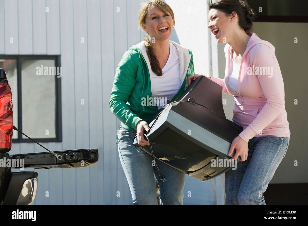 Carrying television hi-res stock photography and images - Alamy