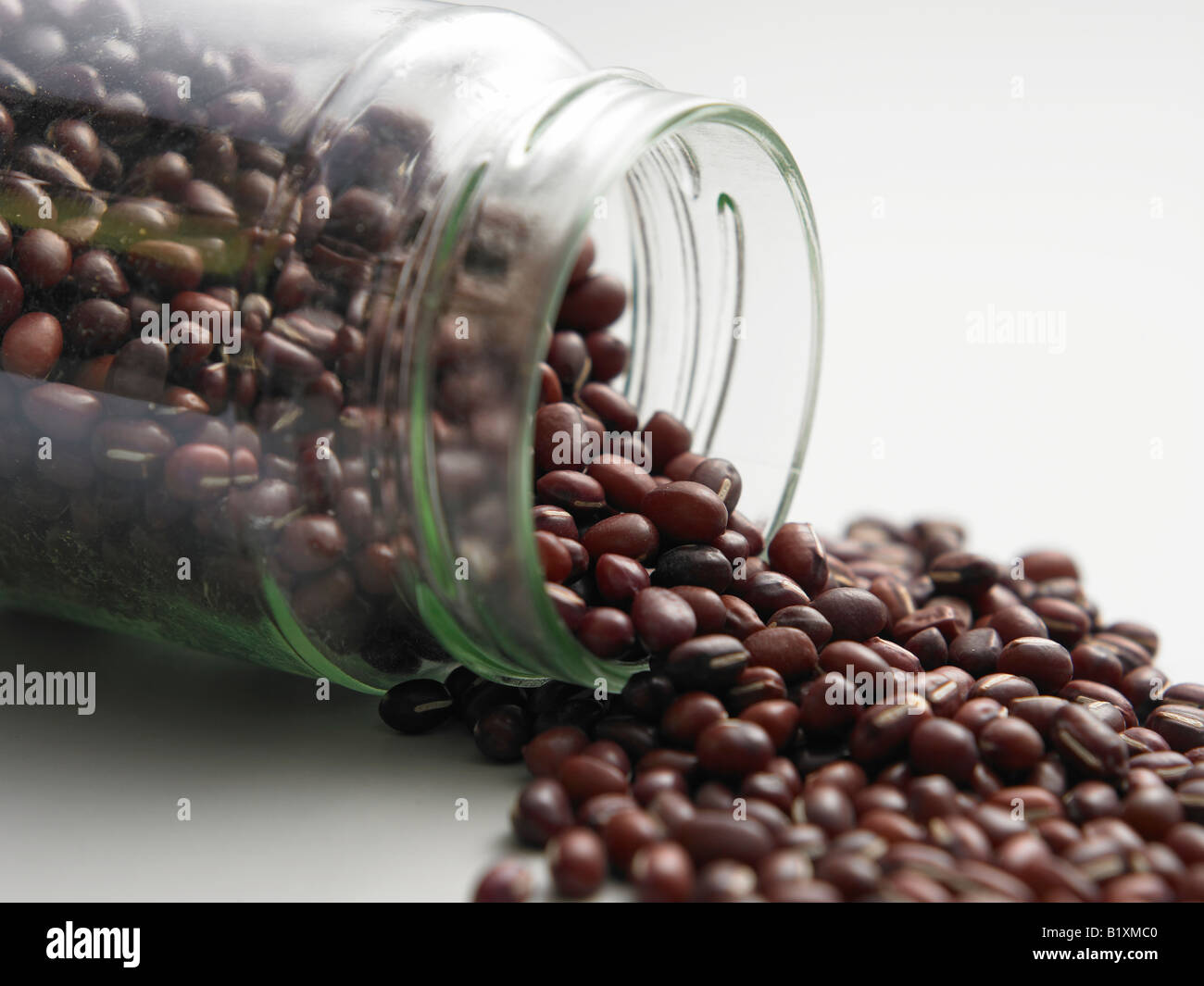red beans spilled out from jar Stock Photo - Alamy