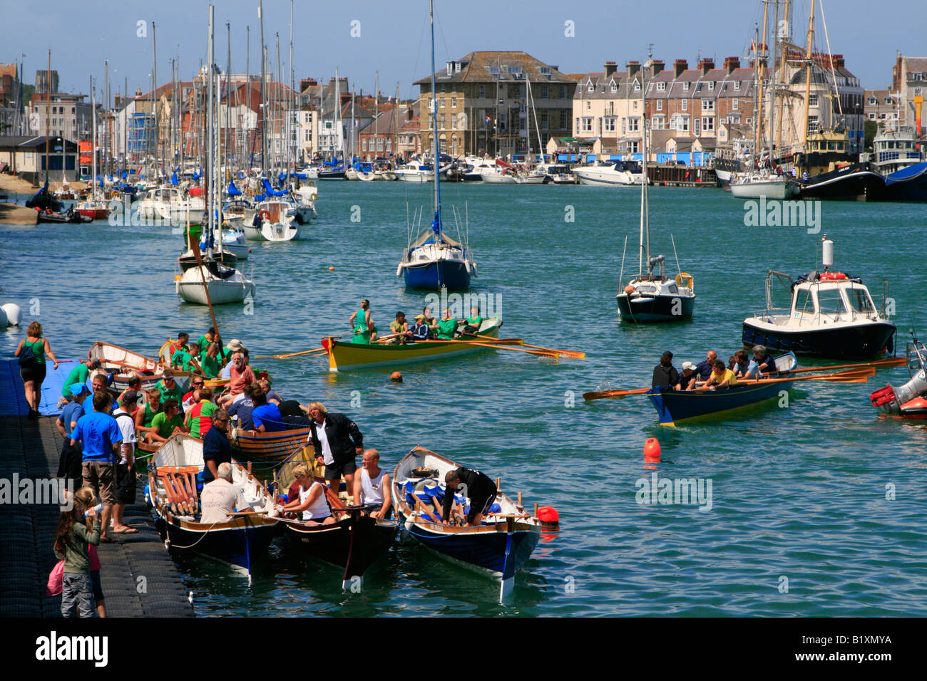 weymouth rowing club hosting gig rowing boat racing event summer ...