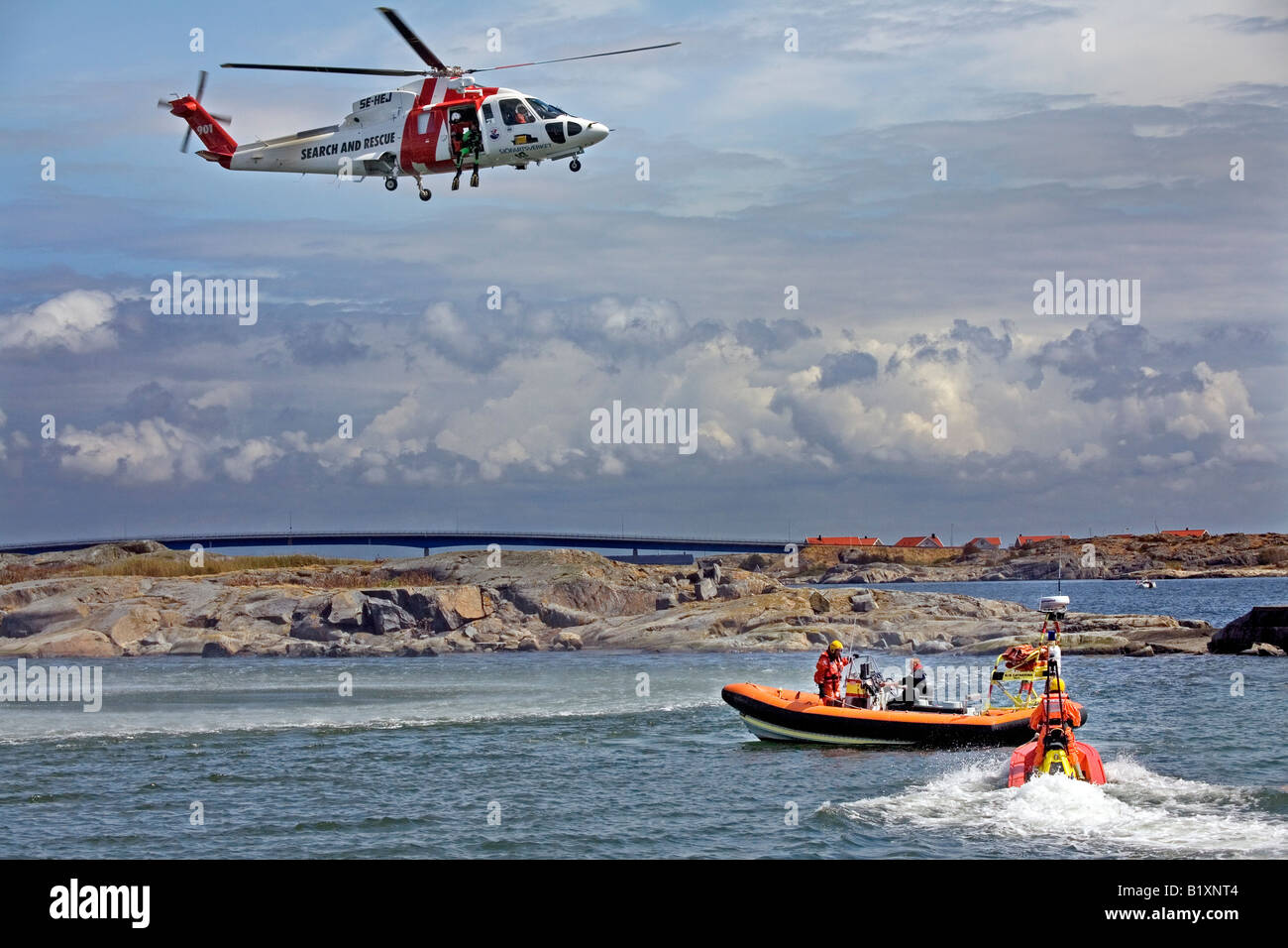 Search and rescue SAR helicopter and boat team during exercise in ...