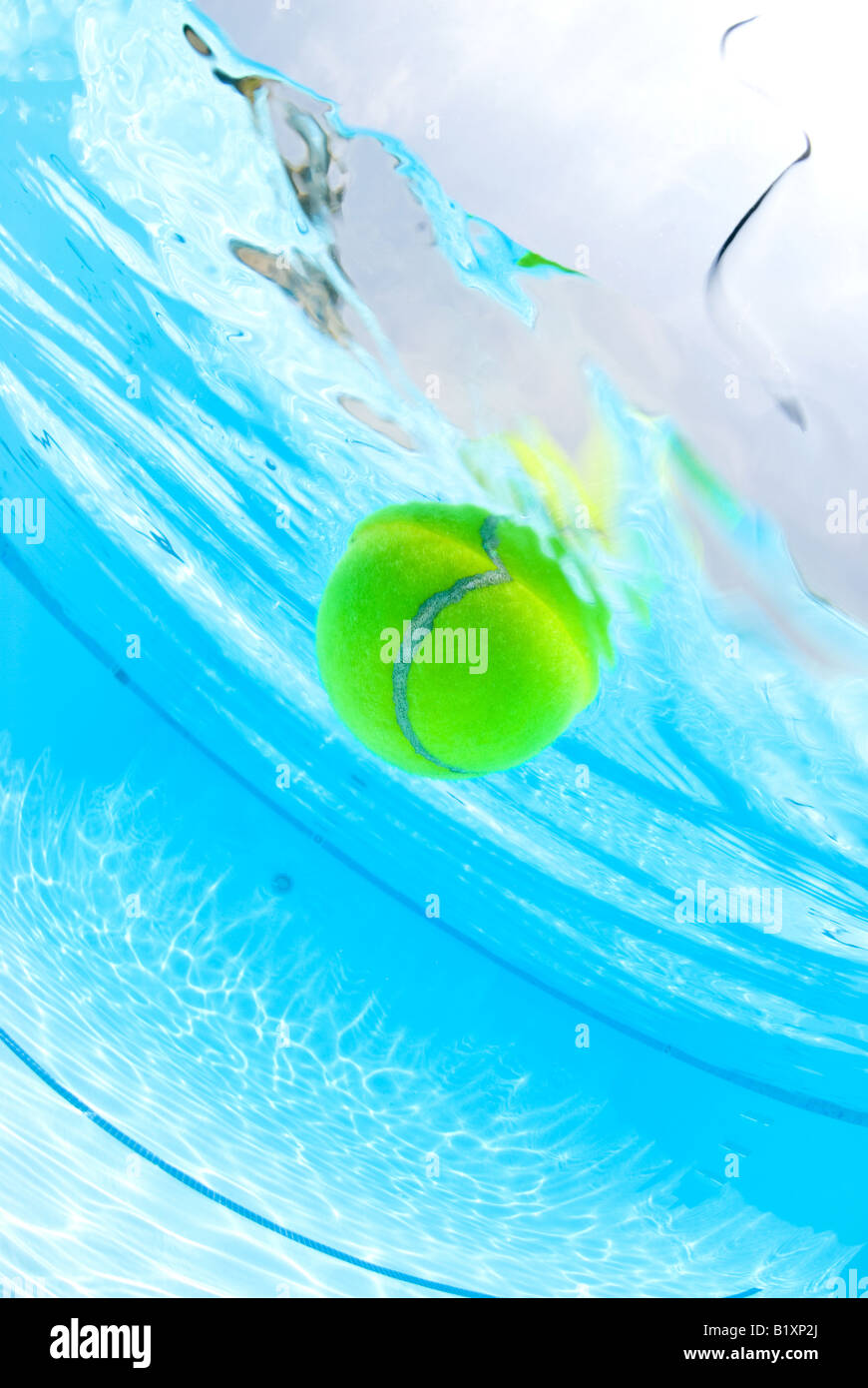 Tennis ball floating in pool Stock Photo - Alamy