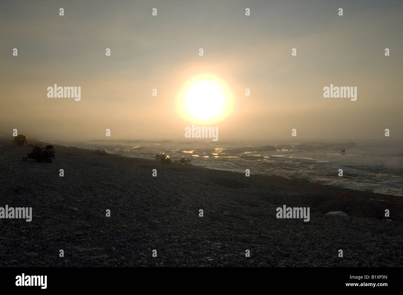 A Haze sun over an inlet in the Arctic Stock Photo - Alamy
