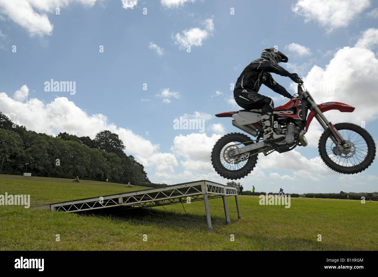 Grasstrack racing jumping a ramp Stock Photo - Alamy