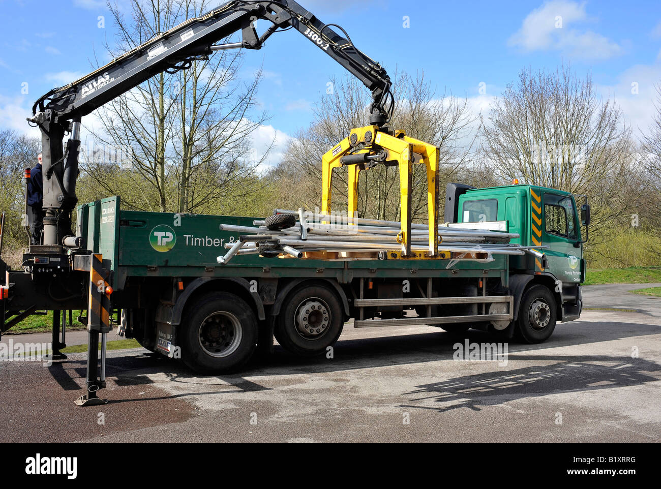 A truck mounted crane unloads goods from the truck Stock Photo - Alamy A truck mounted crane unloads goods from the truck Stock Photo - Alamy