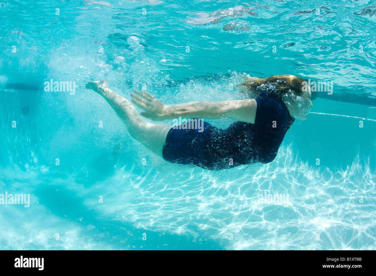 Woman breath holding underwater hi-res stock photography and images - Alamy