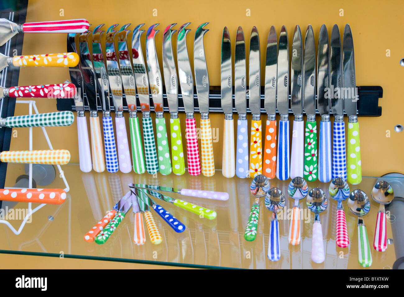 Designer cutlery knives and forks for sale in a shop window Stock Photo ...