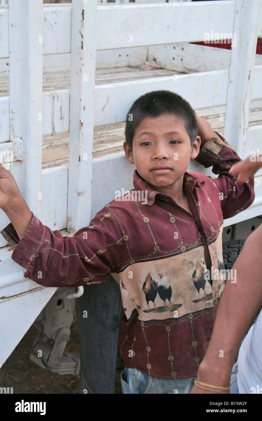 A young field worker boy beside a truck Stock Photo - Alamy
