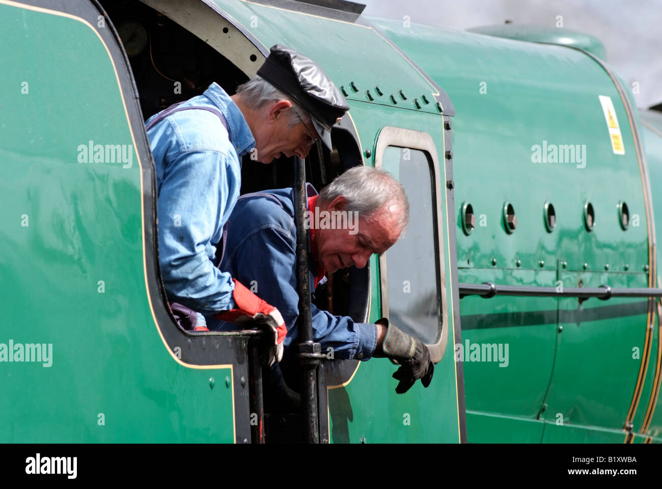 Engine driver and fireman aboard the steam locomotive the Lord Nelson ...