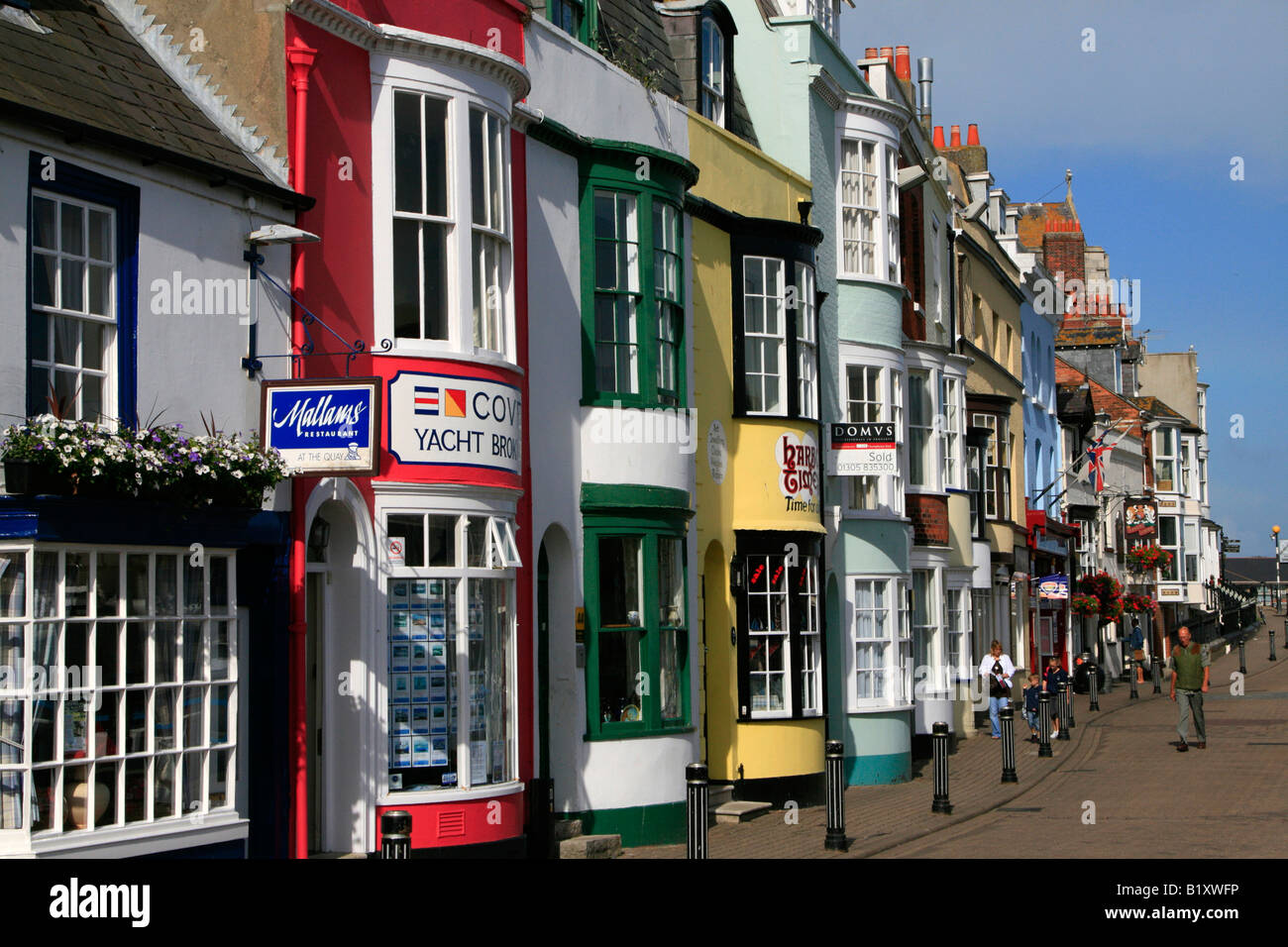line of pretty coloured harbour town houses weymouth dorset england uk ...