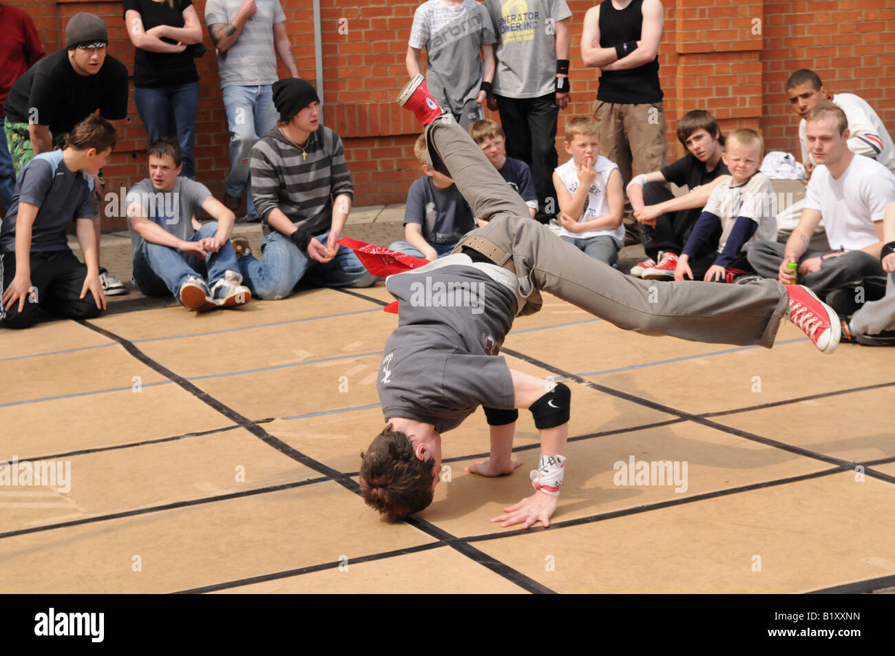 Breakdancers being watched by crowd in Derbyshire England Stock Photo ...