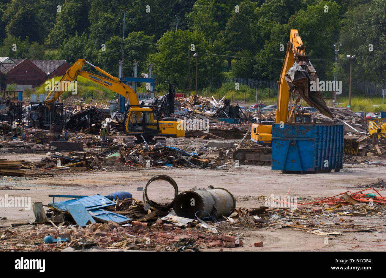 Excavators sorting scrap metal at demolition of former Whiteheads ...