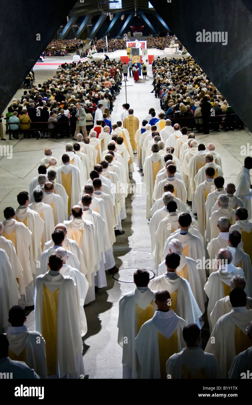 FRANCE, LOURDES. Mass in the under earth church in Lourdes France Stock ...