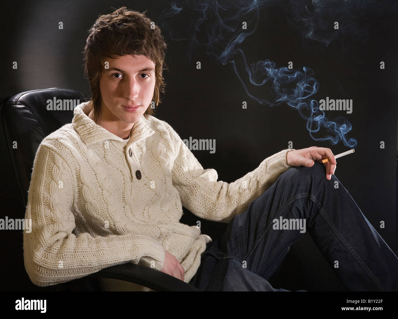 A young fashionable man smoking Stock Photo - Alamy