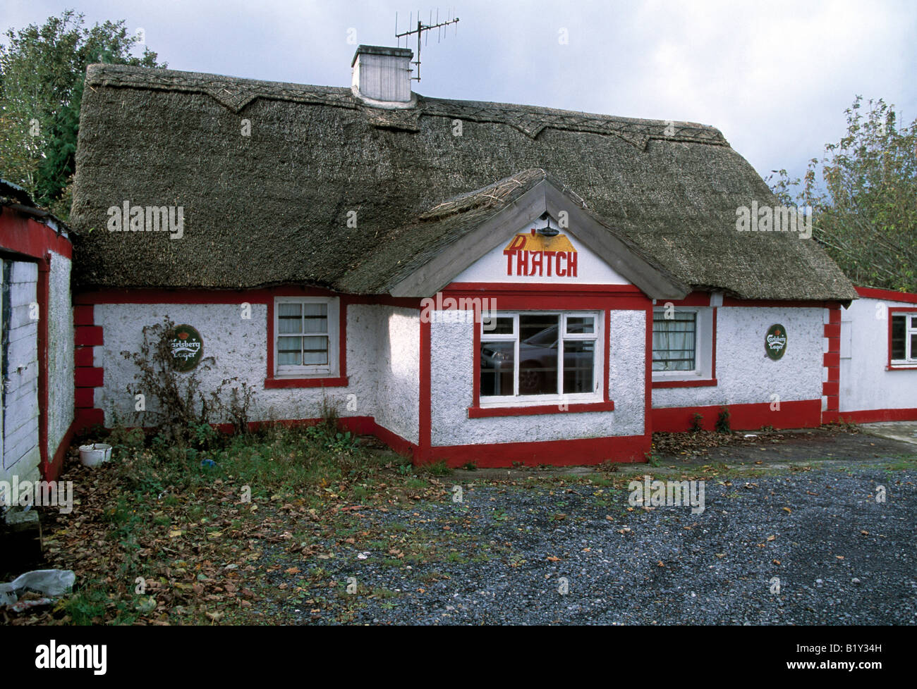 old thatched pub/ bar, sits forlorn in the irish rural country side ...