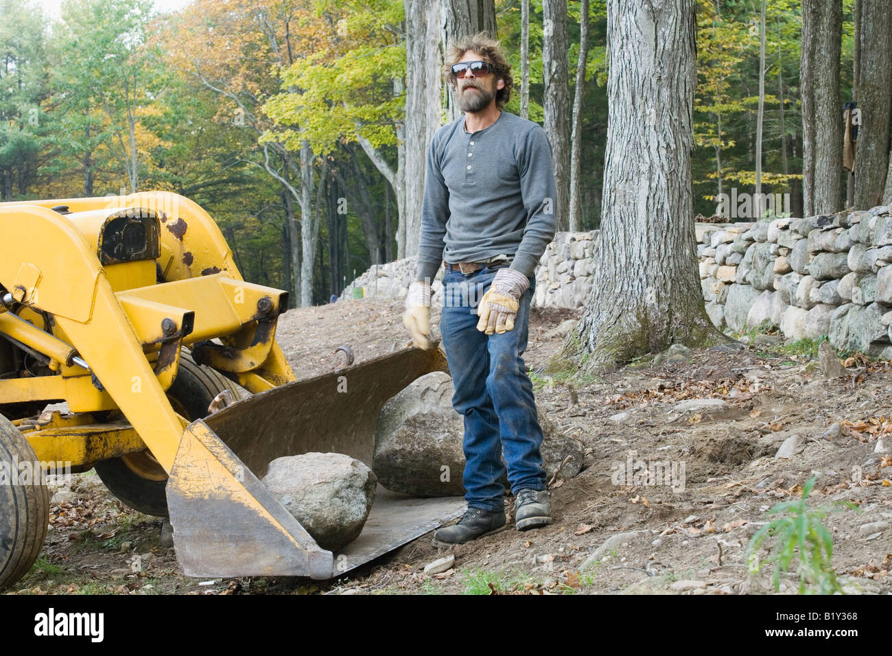Man building stone fences Stock Photo - Alamy