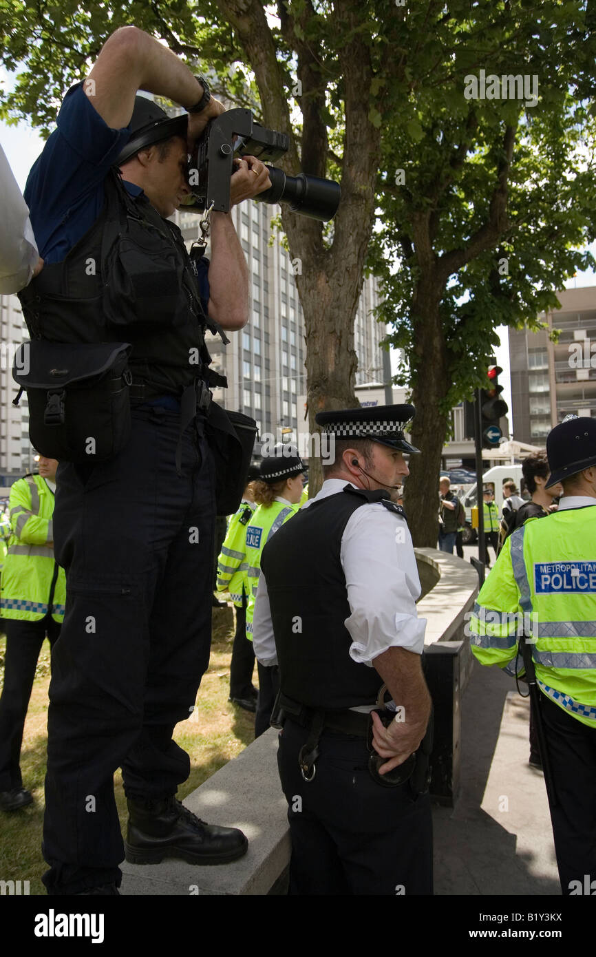 Police cameraman snaps Anti G8 and No Border demonstrators as they ...