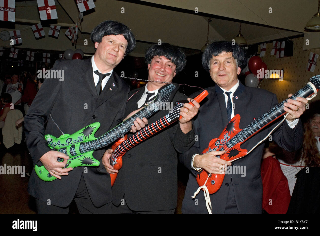 A group of men dressed as the Beatles pose at a St Georges Day fancy ...