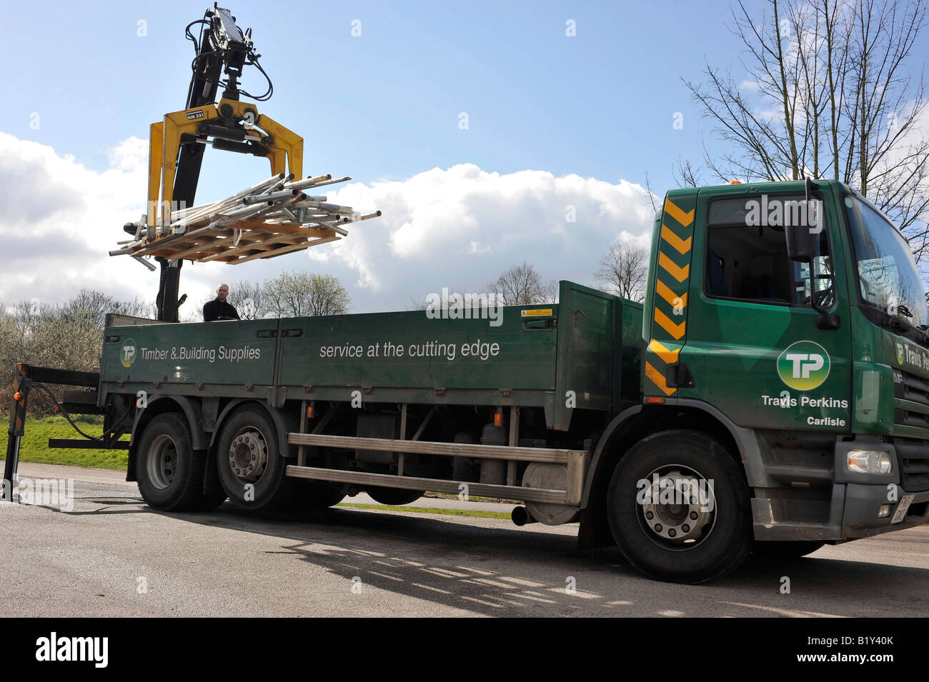 A truck mounted crane unloads goods from the truck Stock Photo - Alamy A truck mounted crane unloads goods from the truck Stock Photo - Alamy