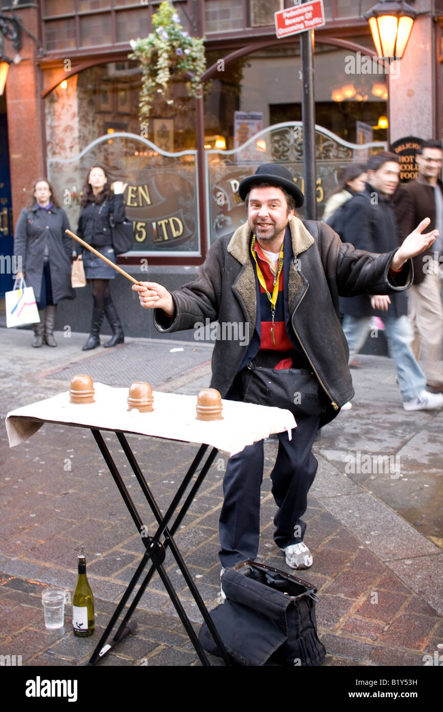 A magician performs near London's Covent Garden Stock Photo - Alamy