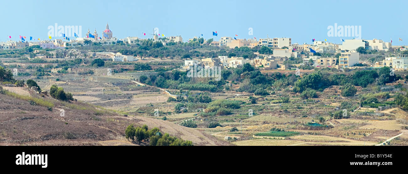 Panorama of Xaghra and buildings with flags on the Island of Gozo ...