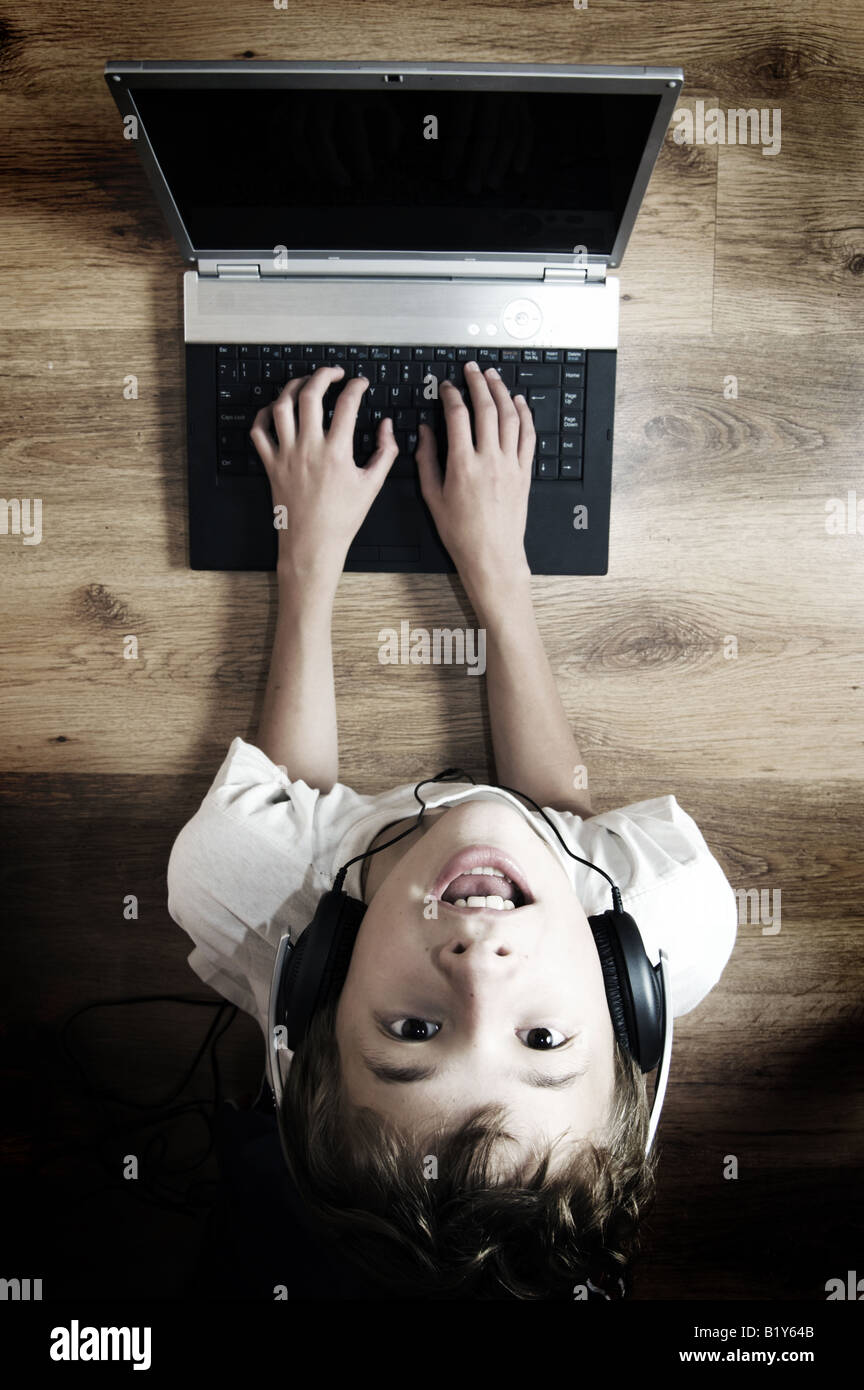 Young boy working on the laptop Stock Photo - Alamy