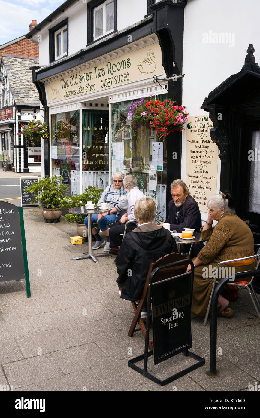 UK Wales Powys Rhayader town centre people sitting outside historic Old ...
