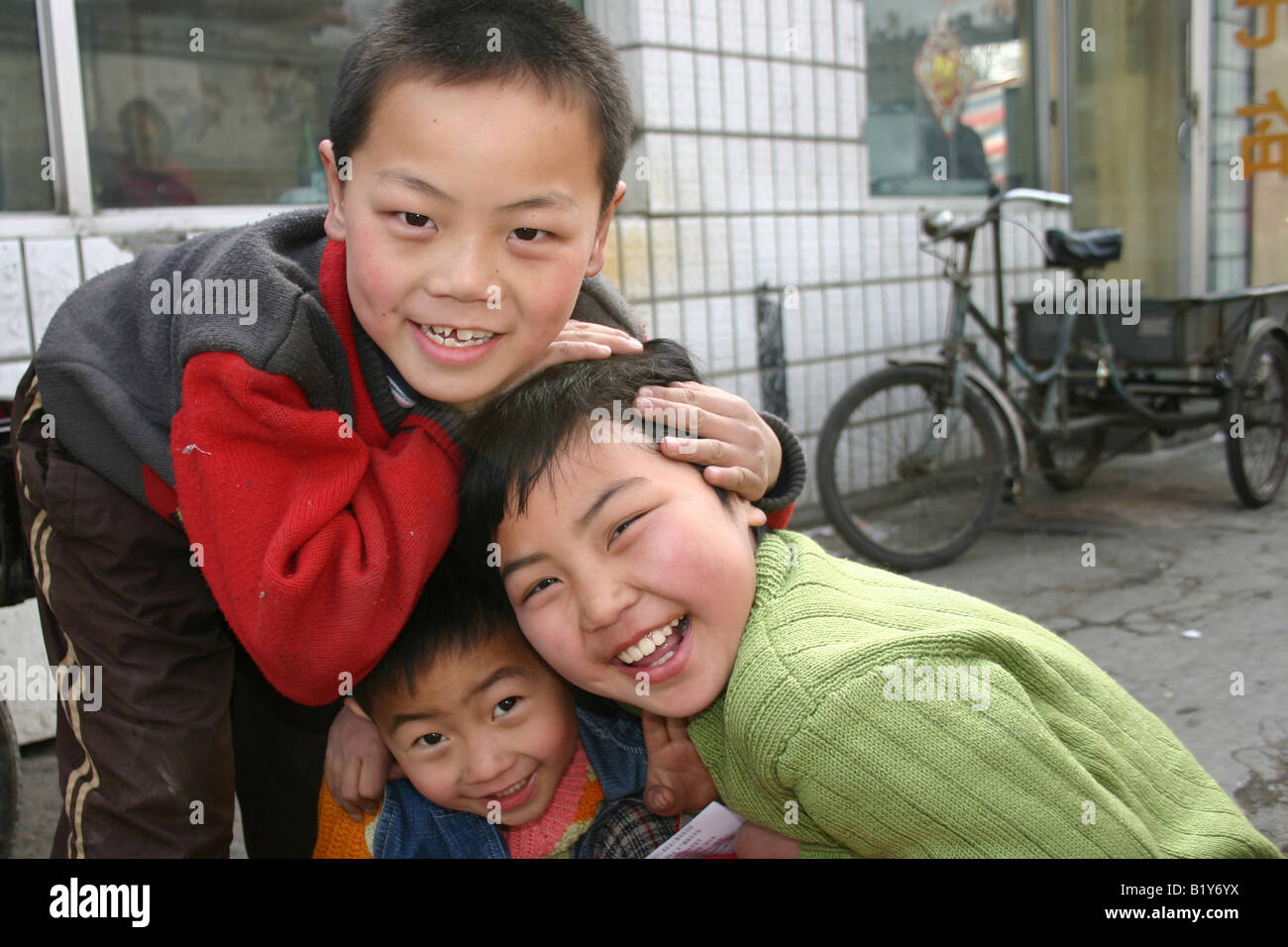 Scenes from the city of Beijing China 2004, children having fun in a ...
