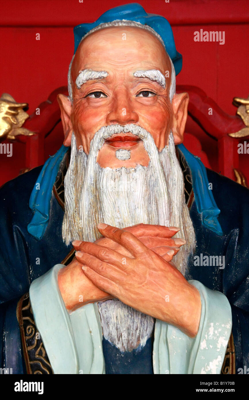 Carved and painted wooden statue of Confucius at the Confucian Temple ...