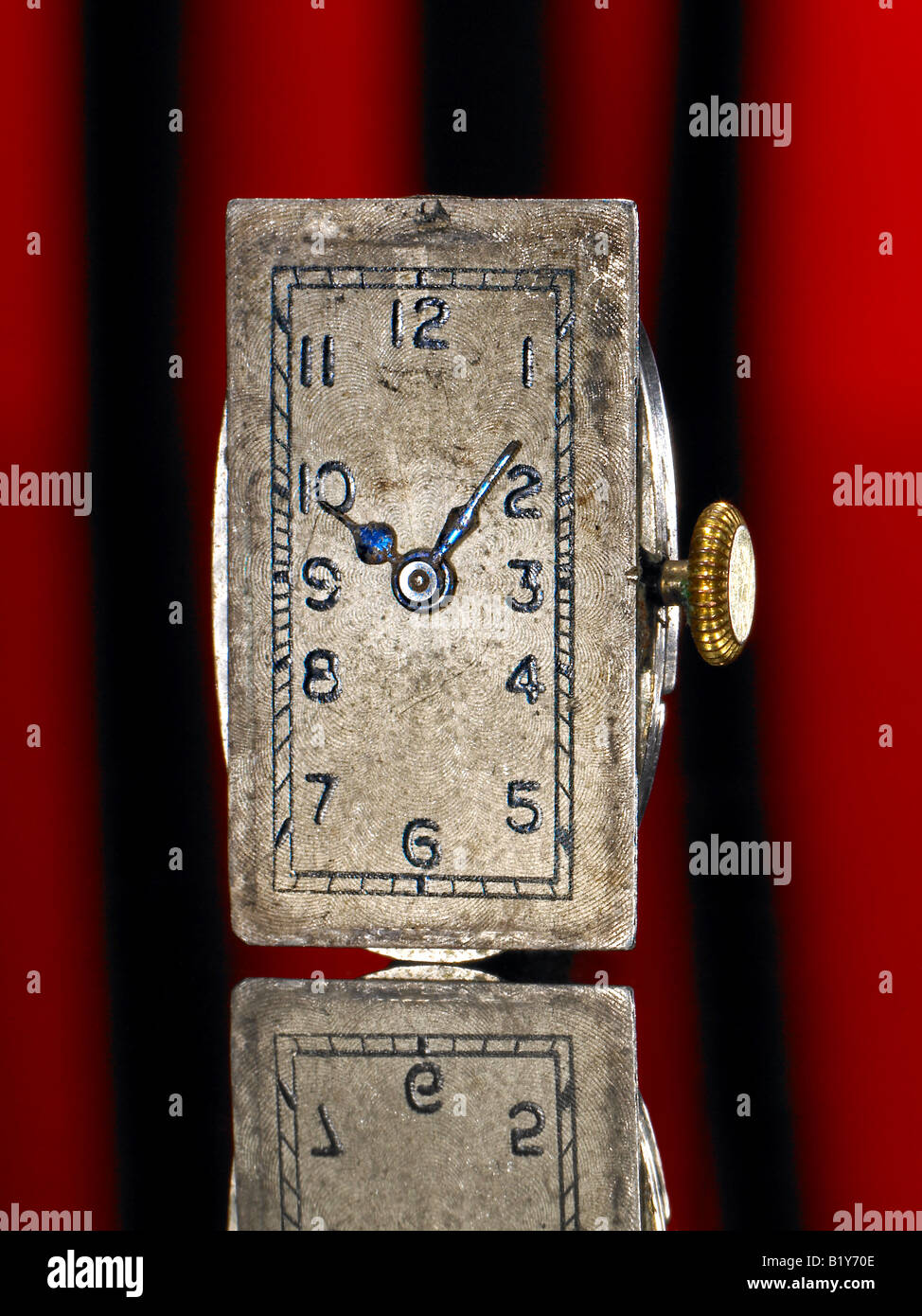 Vintage watch face photographed on red background Stock Photo - Alamy
