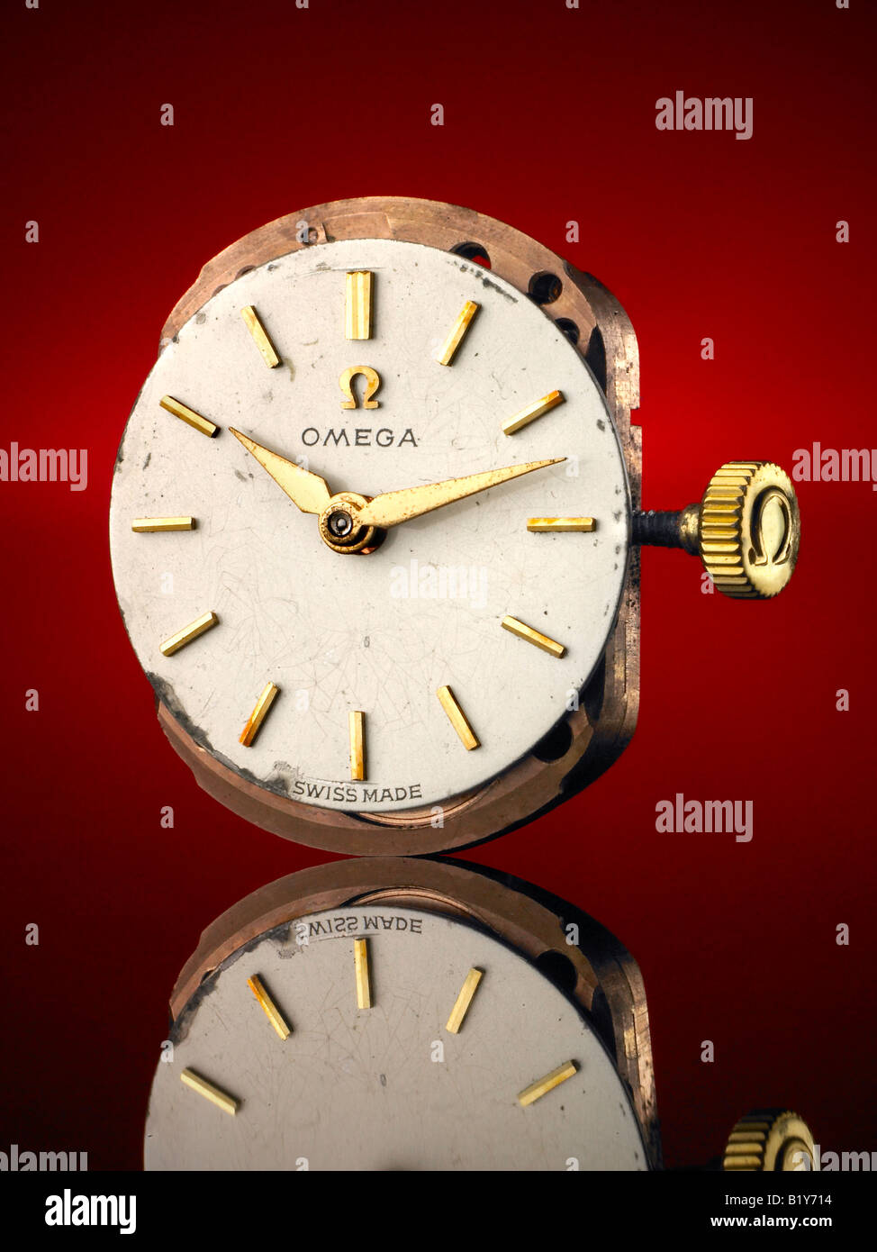 Vintage omega watch face photographed on red background Stock Photo - Alamy