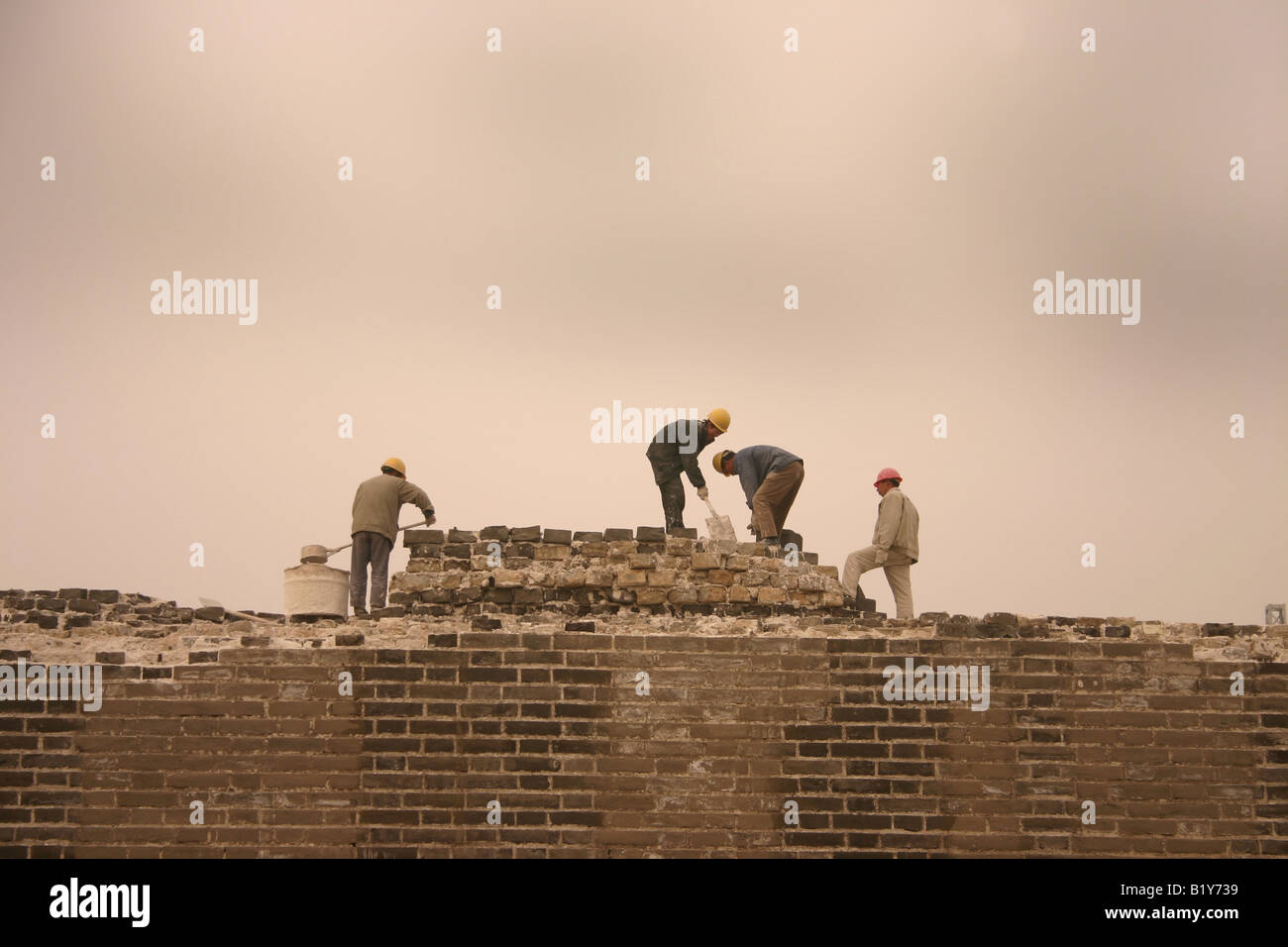 Scenes from the city of Beijing China 2004, workers on a wall Stock ...